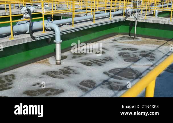 pool of dirty sludge waste pumping to sewage water plant. Environment ...