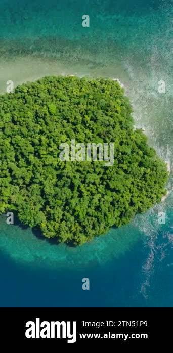 Tropical island with sandbar beach with waves and turquoise water atoll ...