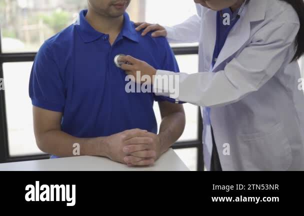 Doctor checking patient's respiratory rate or pulse rate by using ...