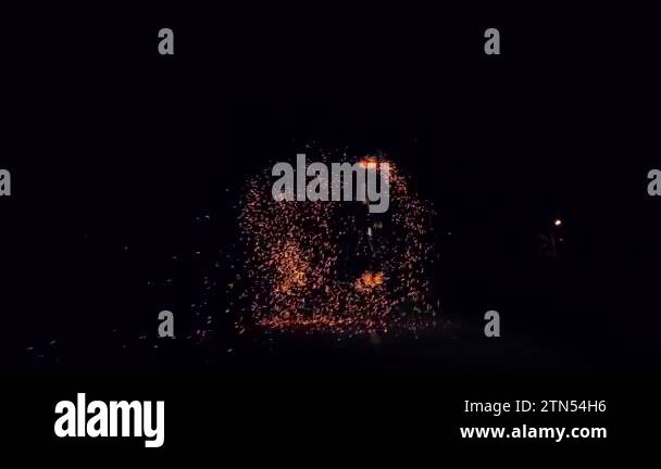 Spinning firework wheel, sparkles all around. Fire show. Fireworks ...