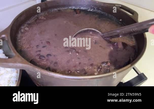 ugly, not appetizing food boiled beans in saucepan to pick up with a ...
