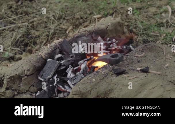 Ancient small primitive smithery with clay grounded forge Stock Video ...