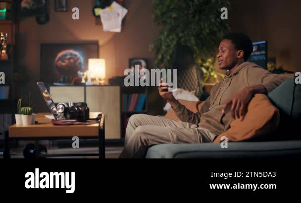 Dance Choreographer African American man using his cellphone to share ...