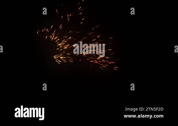 4K Special effect of spark particles on Black Background. Sparks from ...