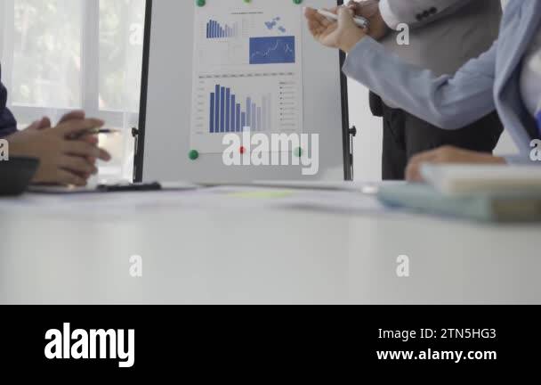 Accountant pointing to business graph chart Financial business report ...