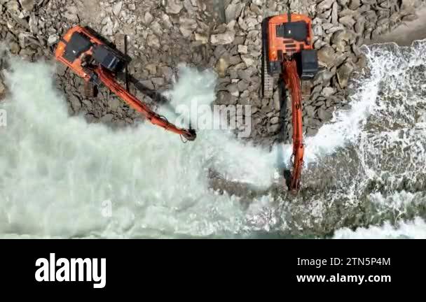 Take an aerial survey of a beach construction site where breakers are ...