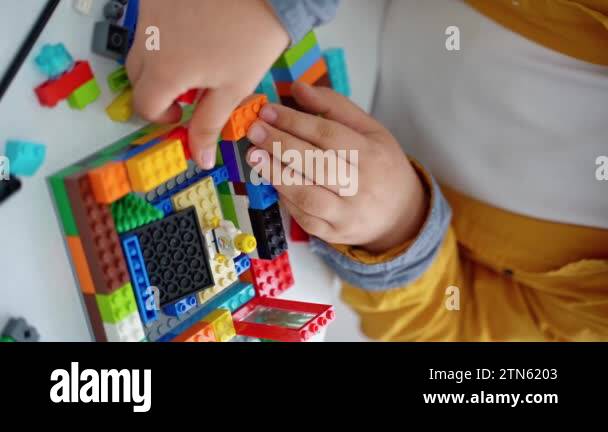 Robotics programming class. Children construct and code Robot. STEM education using constructor ...