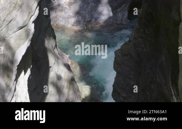 River between rocks of a narrow gorge. Stream of water is squeezed ...