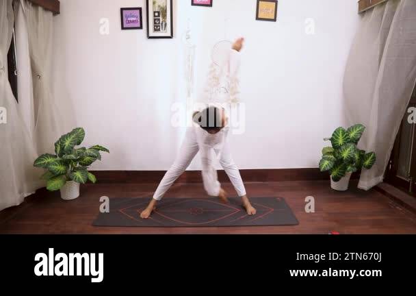 Video of woman performing Parivrtta Trikonasana swing (Revolved Triangle Pose) strengthens the ...
