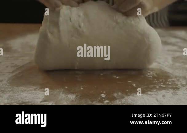Close-up of chef hands Baker kneading bread dough home made bread ...