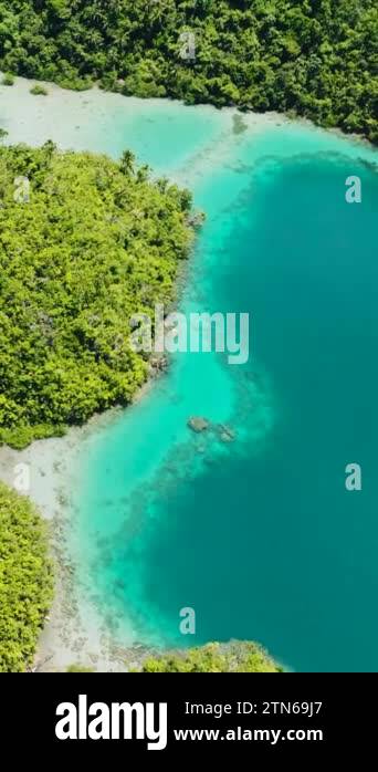Vertical view of beautiful turquoise lagoons inside of Tinago Island ...