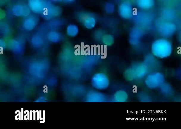 Golden glitter background. Beautiful transition with real gold particles. flying in wind on ...