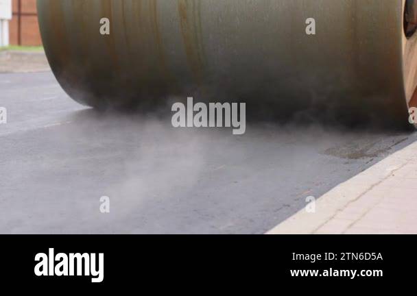 Slow motion Repair surface road, laying a new layer of pavement on a ...