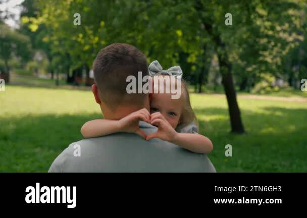 Happy family Father and daughter hugging each other in the park Father ...