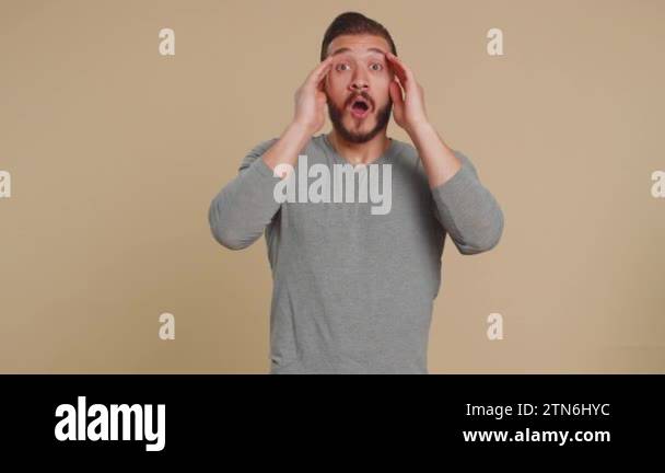 Oh my God, Wow. Excited amazed winner man surprise looking at camera ...