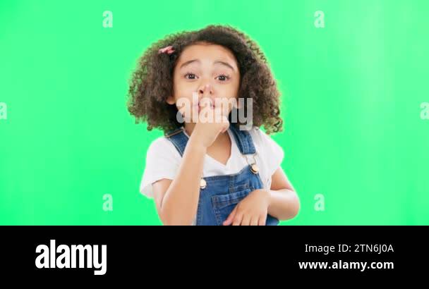 Face, green screen and child with finger on lips for quiet, silence or ...