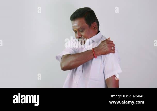 This video is about A south indian man having shoulder pain on white ...