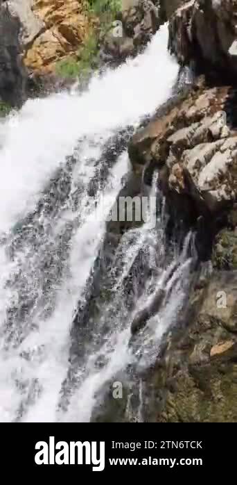 Discover the serenity of a mesmerizing waterfall with azure waters in ...