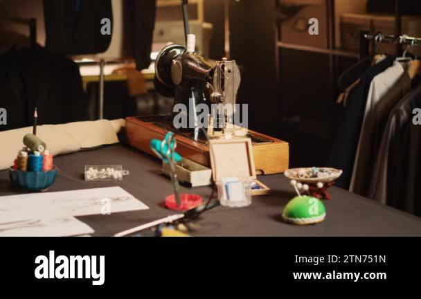 Industrial sewing machine and needles in fashion atelier, luxury craftsmanship with tailoring ...
