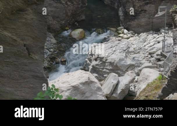 River between rocks of a narrow gorge. Stream of water is squeezed ...