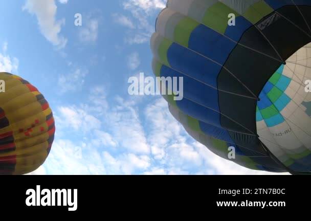Big balloon leaning down, tilting down at balloon festival. The ...