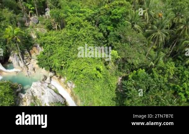 Drone footage of a beautiful waterfall in the Philippines with blue ...