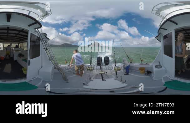360 VR Family traveling by yacht fishing on its way in the ocean ...