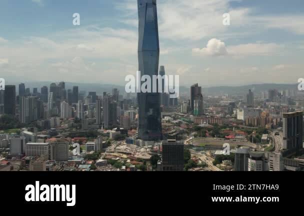 Kuala Lumpur, Malaysia - June 8, 2023 Cinematic moving up revealing the ...
