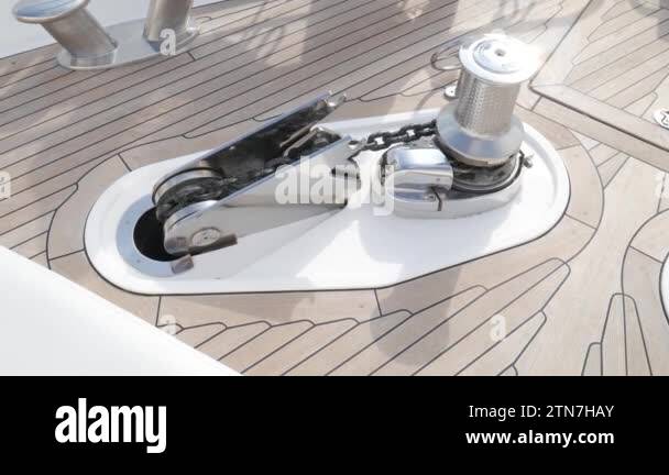 Anchoring system on the yacht. The thick chain lifts the anchor Stock ...