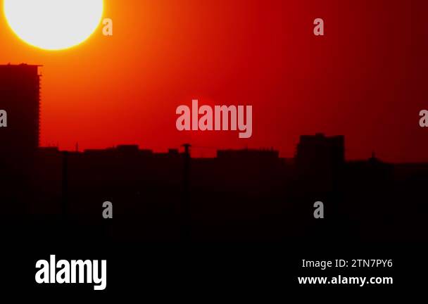 City skyline hot cinematic sunset, downtown cityscape lit with large ...