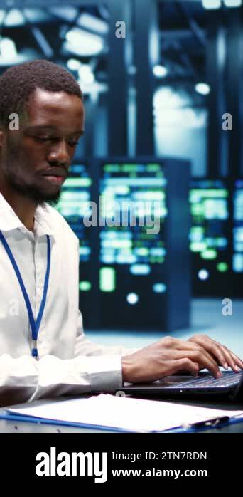 Vertical video Computer scientist fixing server operational issues ... Vertical video Computer scientist fixing server operational issues ...