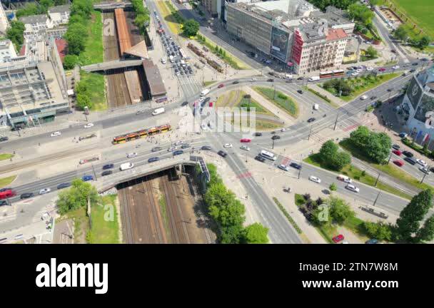 Vehicles on a busy roundabout junction. Traffic circle with a lot of cars. Top down aerial view ...