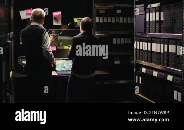 Team of experts connecting clues on board, trying to find all hidden ...