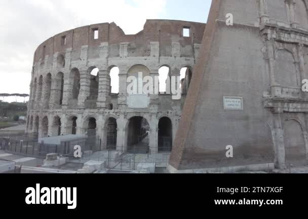 Pan right to Colosseum or Amphitheatrum Flavium greatest amphitheater ...