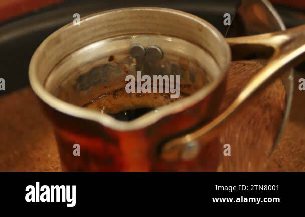 Traditional process boil Turkish coffee in turk Stock Video Footage - Alamy