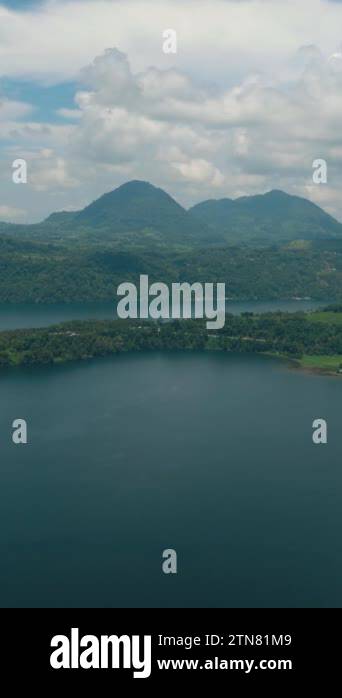 Lake Lanao and mountain with rainforest. Blue sky and clouds. Mindanao ...