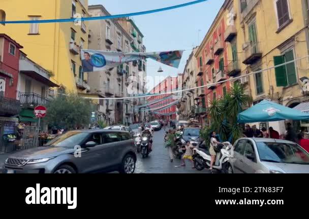 Via dei Tribunali central busy street in Napoli old town. Italian ...
