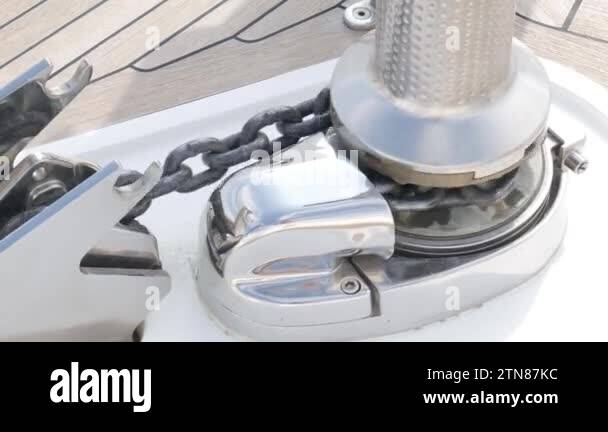 Anchoring system on the yacht. The thick chain lifts the anchor Stock ...