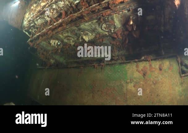 Scuba divers swims on the Shipwreck Swedish ferry MS Zenobia. Wreck diving. Mediterranean sea ...