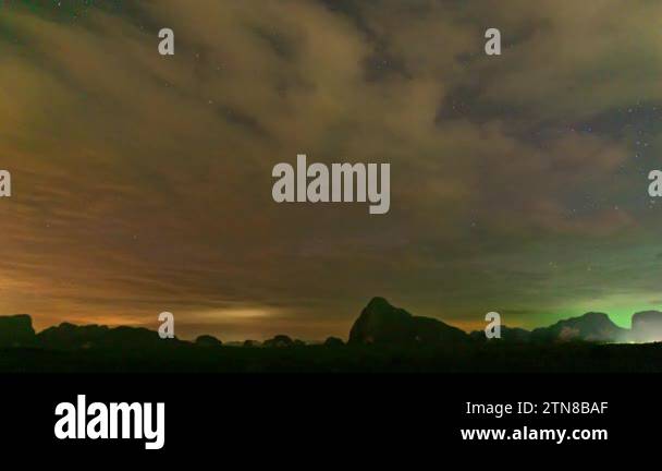 Time lapse amazing night view of nature at night.clouds stars and milky ...