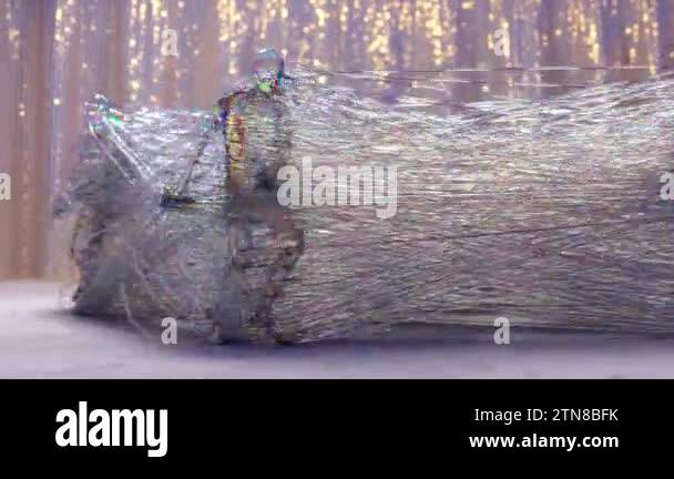 Diamond people entangled in a transparent plastic web dance in a circle ...