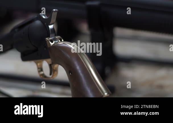 Black drum revolver with a wooden handle. Weapon pistol. Black handgun ...