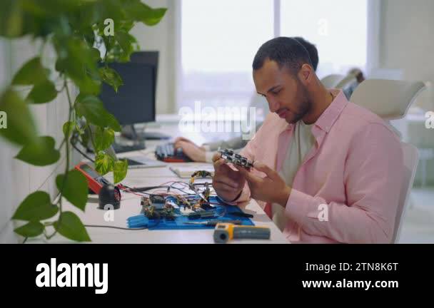 Embedded Systems Programmer Dev Master Checks The Electronic Board And Performs Electrical