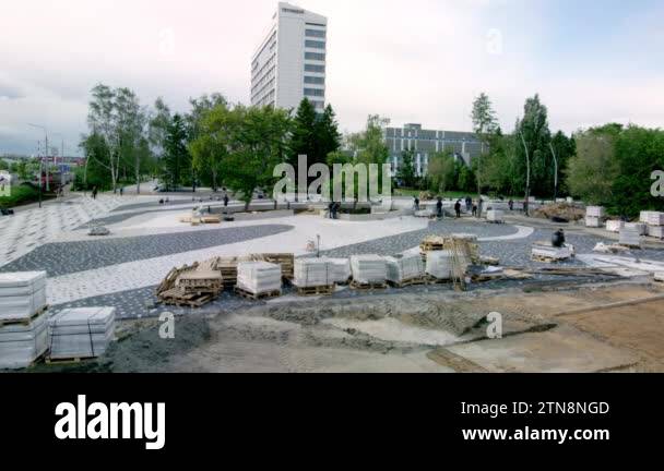 Stone slabs and construction debris laying around park at daytime ...