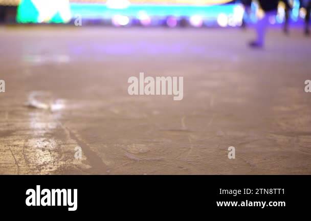 Close-up ice rink on winter night in urban city with unrecognizable ...