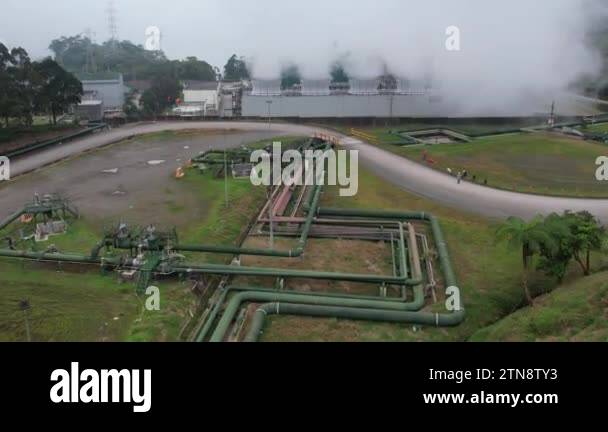Thermal power plant on a volcano in the middle of the jungle, steam ...