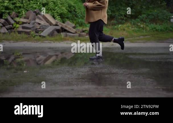Running in puddles Stock Videos & Footage - HD and 4K Video Clips - Alamy