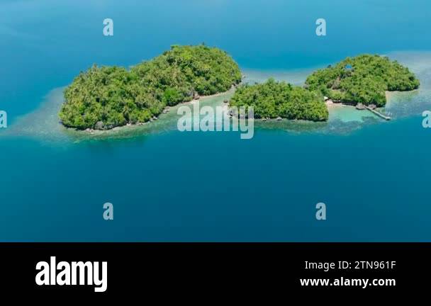Beautiful tropical island and blue sea. Bangkay Island. Mindanao ...