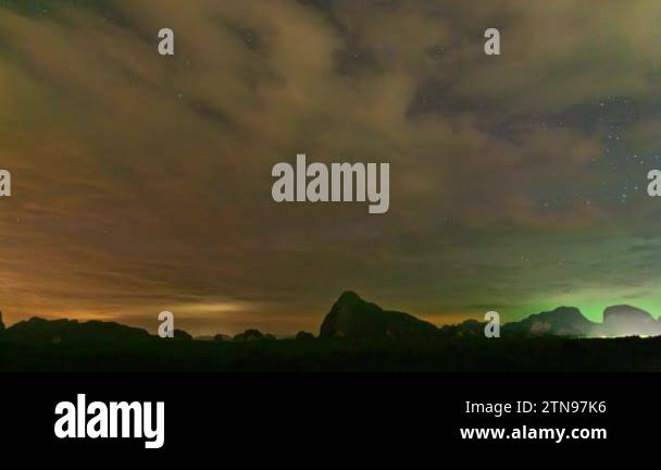 Time lapse amazing night view of nature at night.clouds stars and milky ...