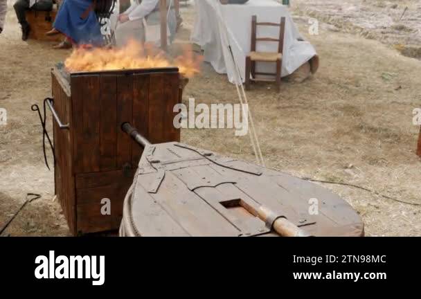 medieval reenactment - using the bellows on a blacksmith forge Stock ...